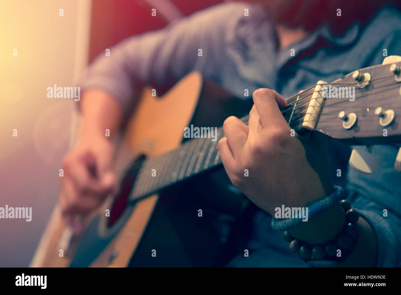 woman's hands playing acoustic guitar, close up Stock Photo - Alamy