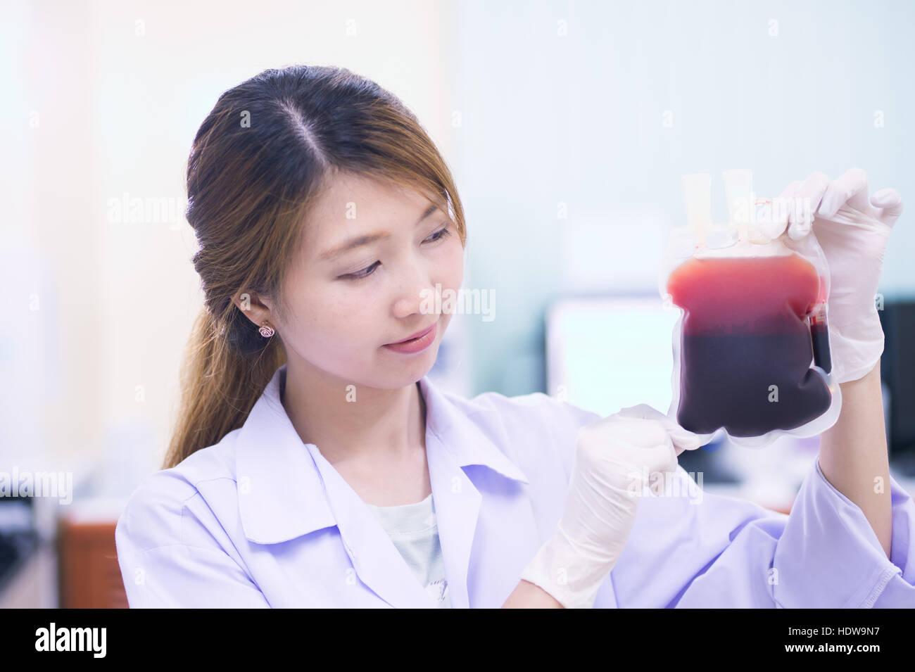 Bag of Blood in hand asian woman Doctor Stock Photo - Alamy