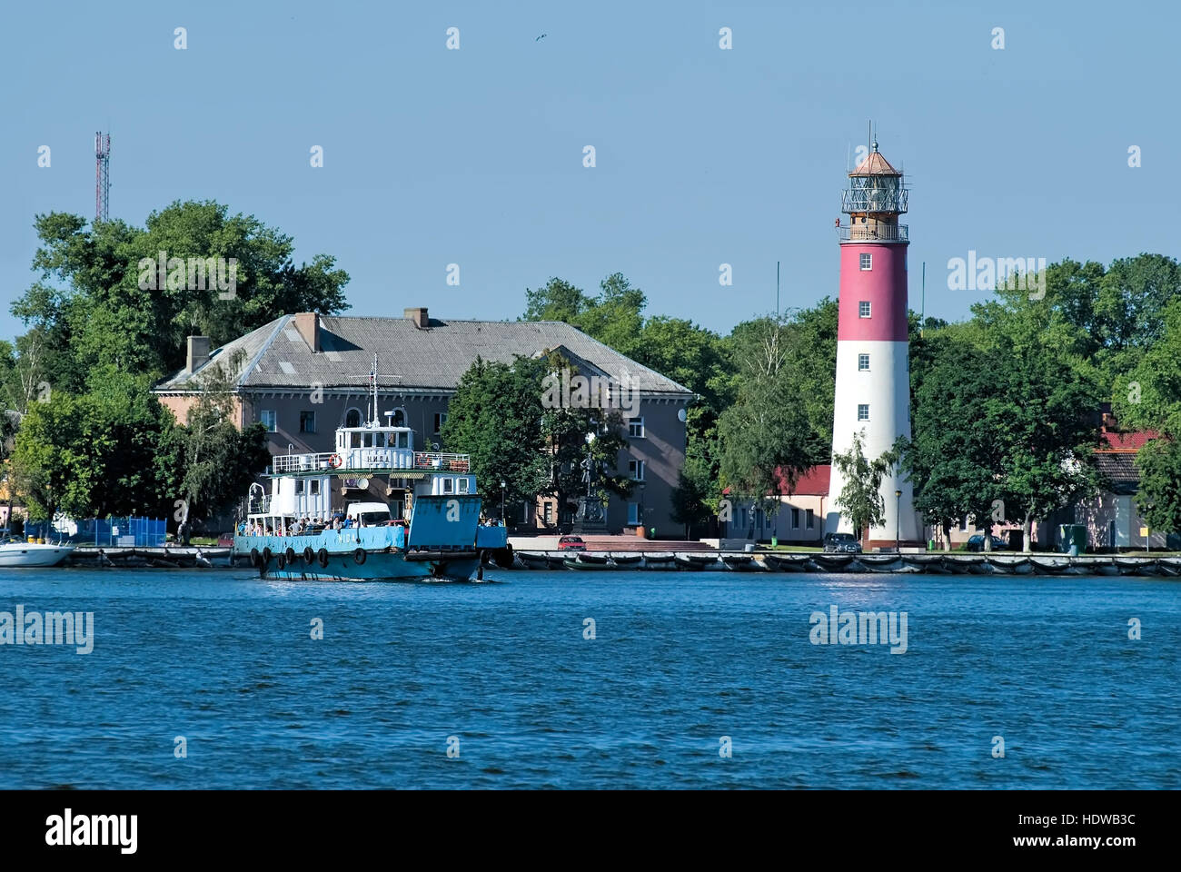 Nida ferry boat and lighthouse in Baltiysk. Russia Stock Photo - Alamy