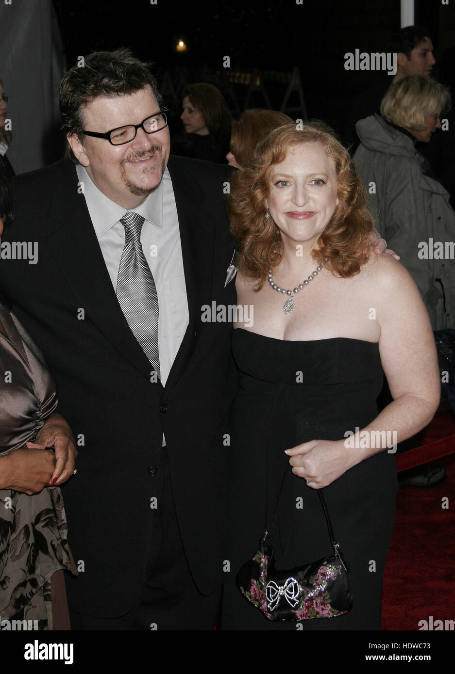Director Michael Moore and his wife Kathleen arrive at the People's ...