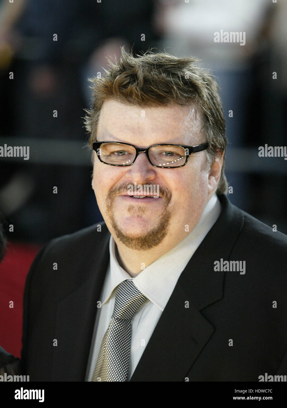 Director Michael Moore arrives at the People's Choice Awards in ...