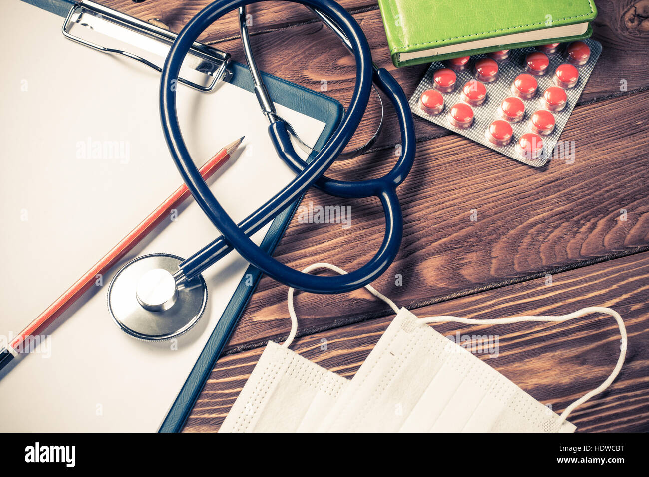Desk of doctor with medicine things Stock Photo - Alamy
