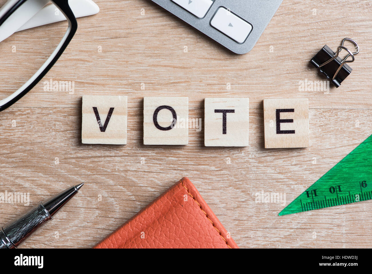 Elements of game with letters spelling business keywords on workplace ...