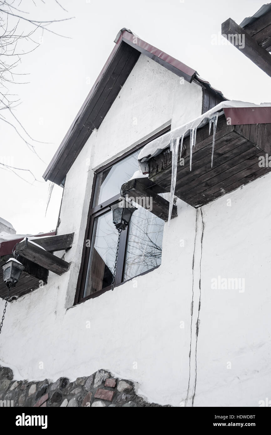 Icy window with a lantern Stock Photo - Alamy