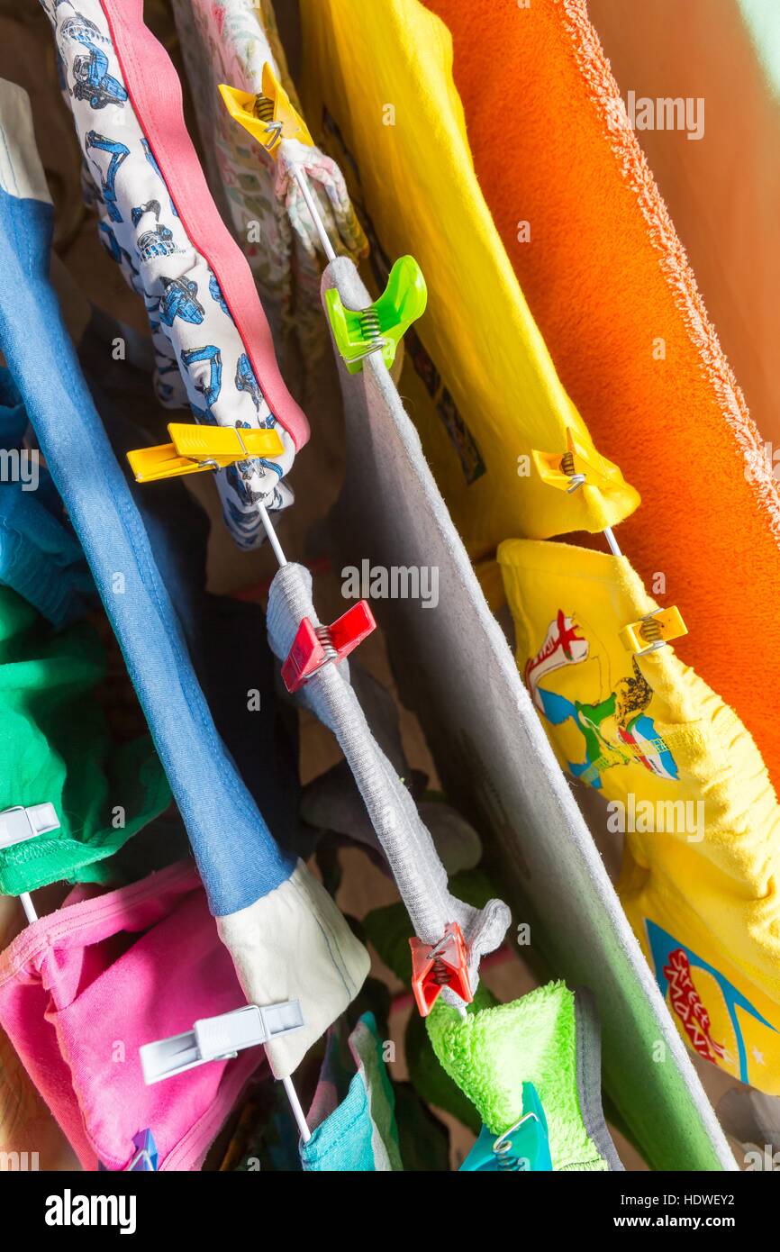 Close up clothes dryer and plastic clips. House clothes drying ...