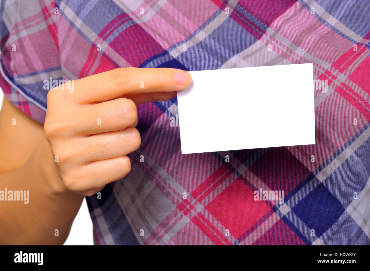 Woman in casual holding empty name card. You can put your message on ...