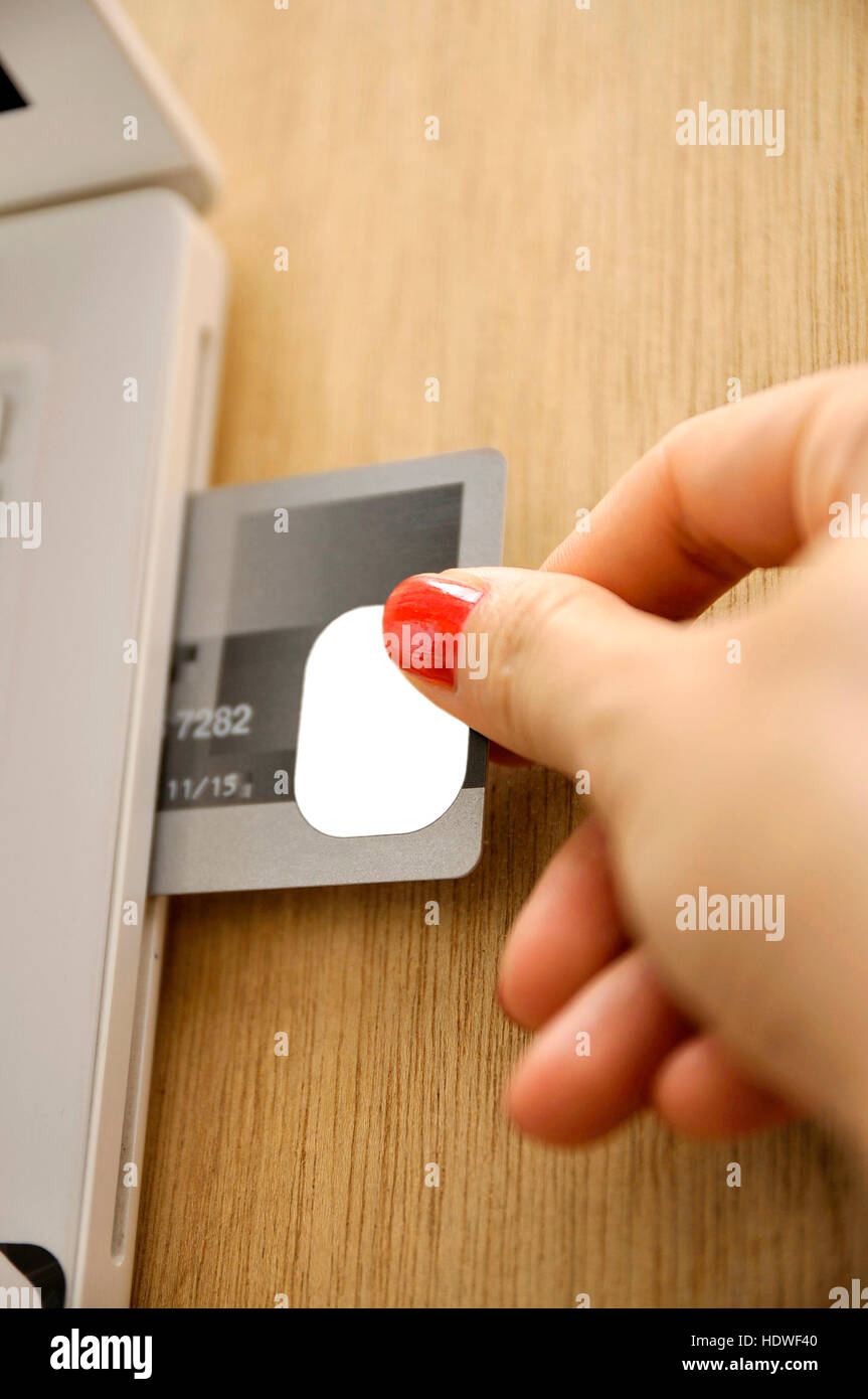 Credit card insert inside laptoo on the wooden desk Stock Photo - Alamy