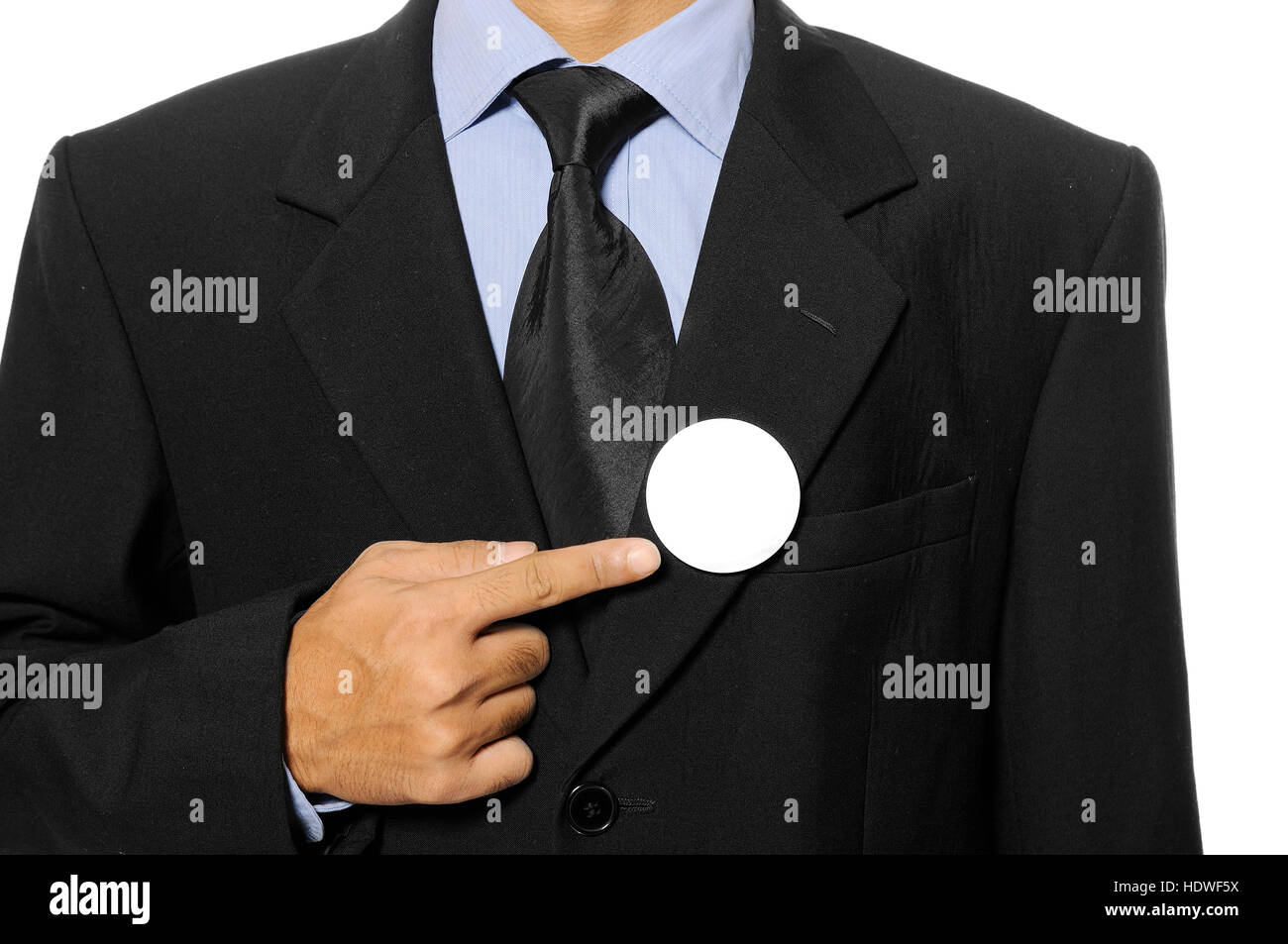 Man with black business suit with blank pinned button. You can put your ...