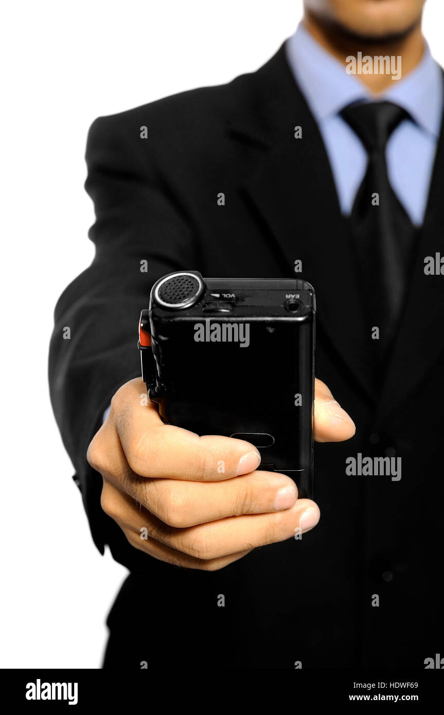 Businessman speaking into a dictaphone recorder isolated over white ...