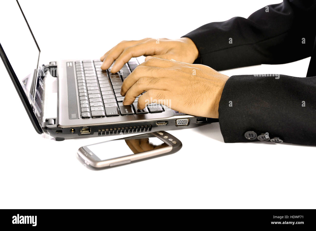 Man typing on laptop isolated over white background Stock Photo - Alamy