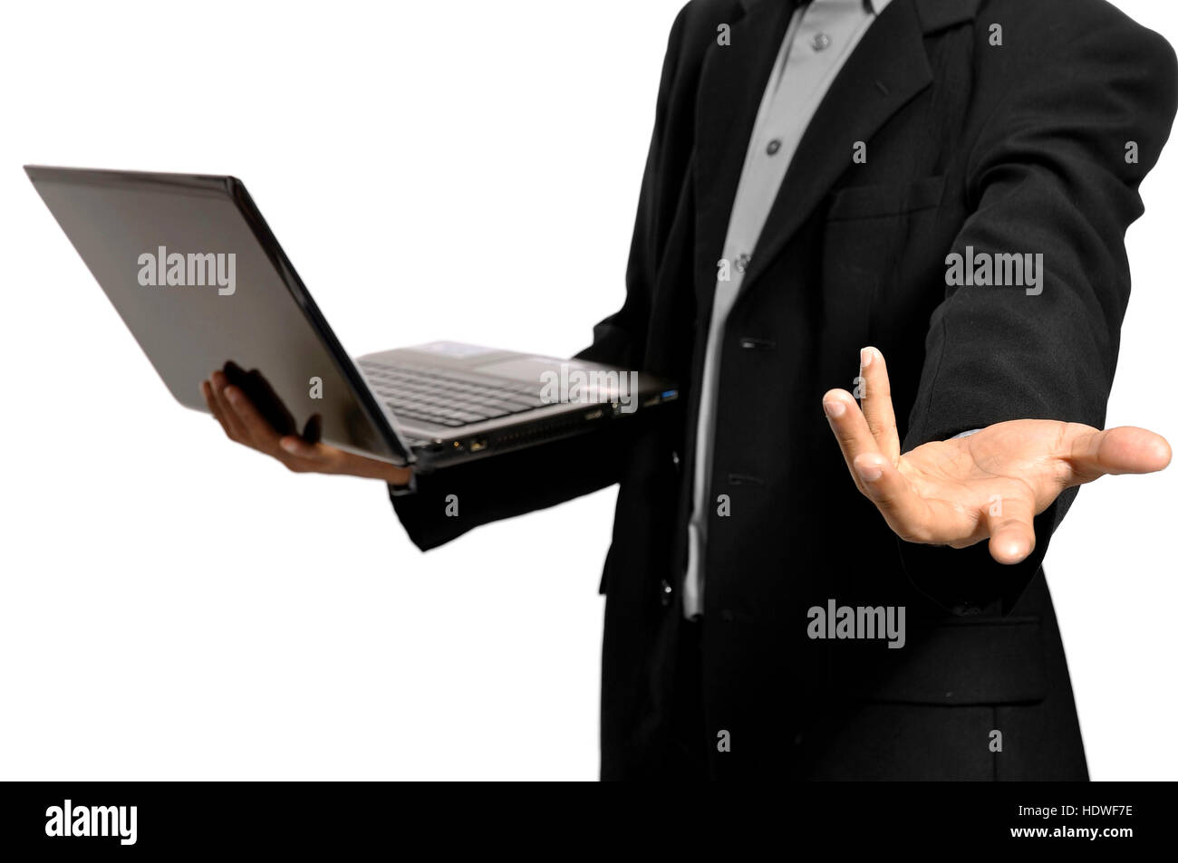 Business man give the hand for help using laptop isolated over white ...
