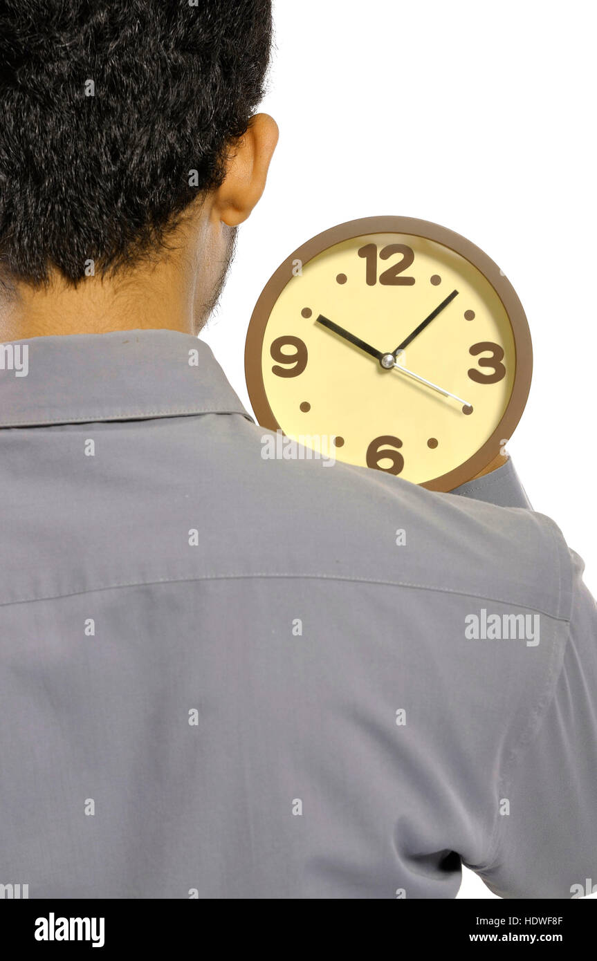 Businessman holding clock in his hand isolated over white background ...