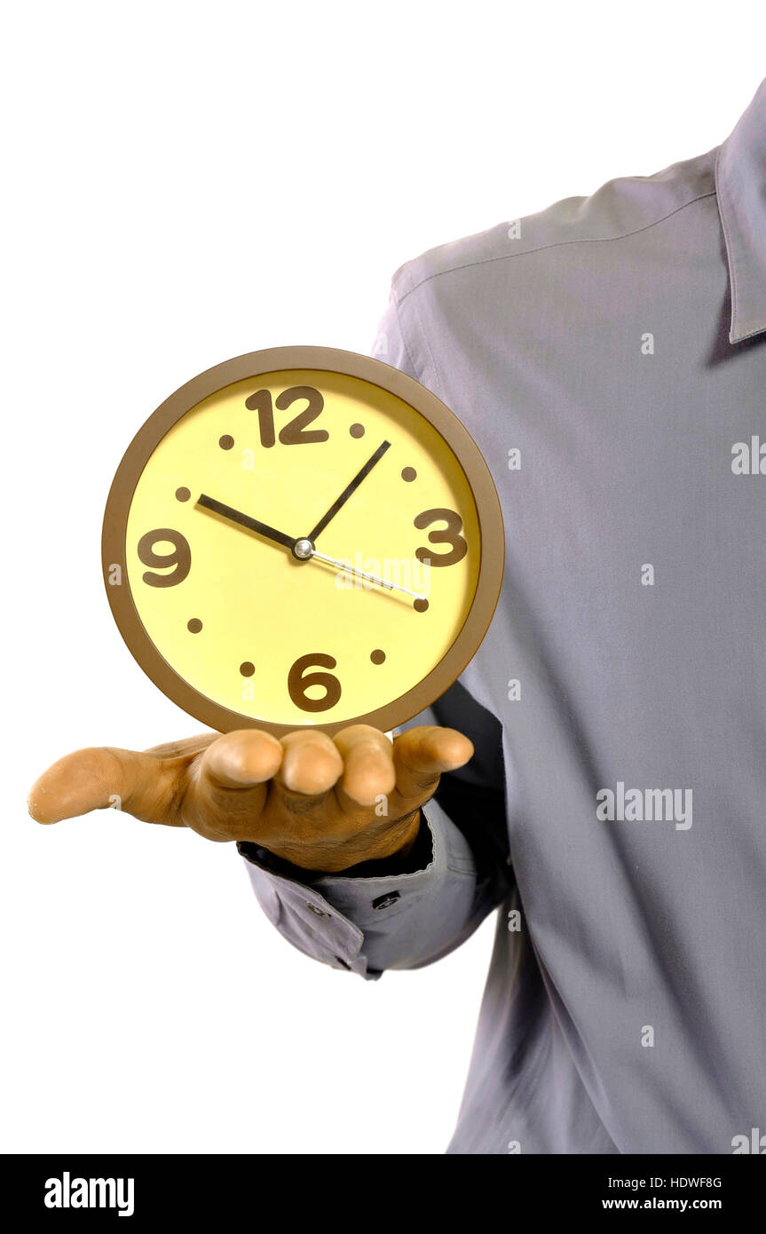 Businessman holding clock in his hand isolated over white background ...