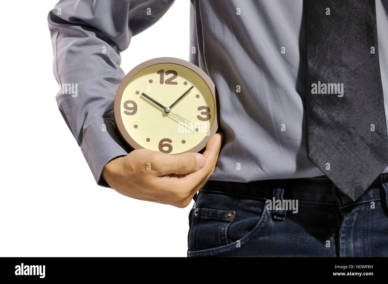 Businessman holding clock in his hand isolated over white background ...