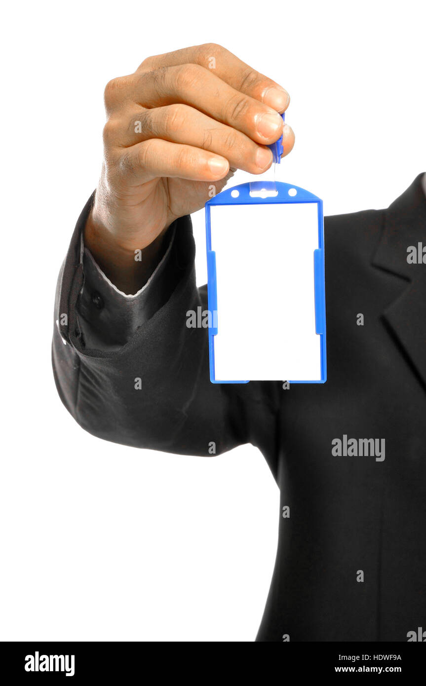 A businessman holding a blank name tag and a sharp business suit Stock ...