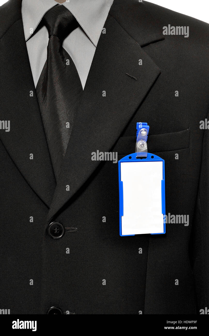 A businessman wearing a blank name tag and a sharp business suit Stock ...