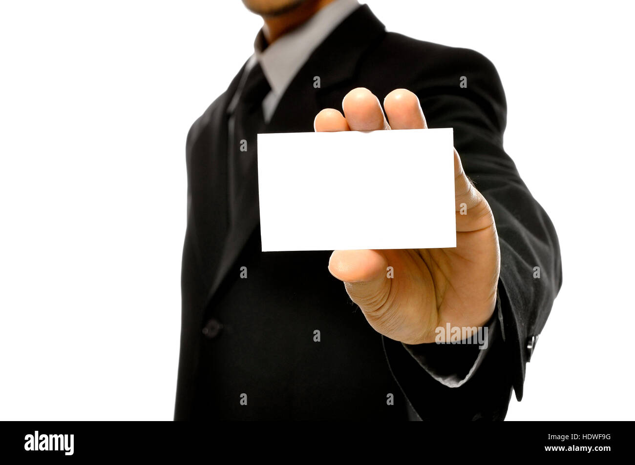 Business man holding name card isolated over white background. You can ...
