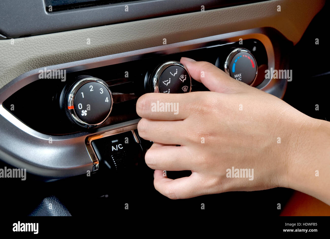 Woman hand controlling heat on her car Stock Photo - Alamy