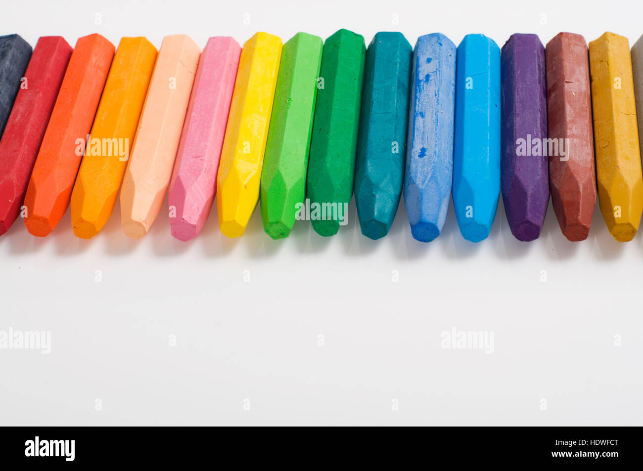 Group of crayons stacked on white background Stock Photo - Alamy