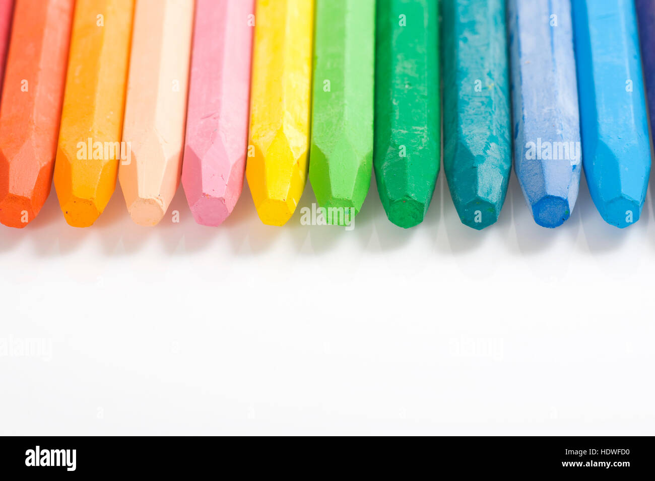 Group of crayons stacked on white background Stock Photo - Alamy