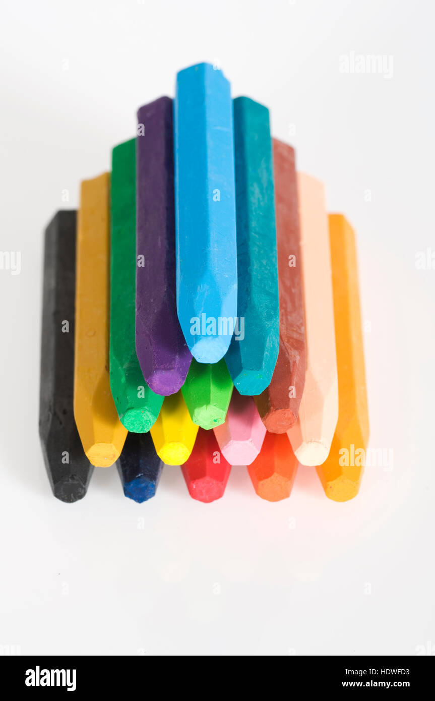 Group of crayons stacked on white background Stock Photo - Alamy