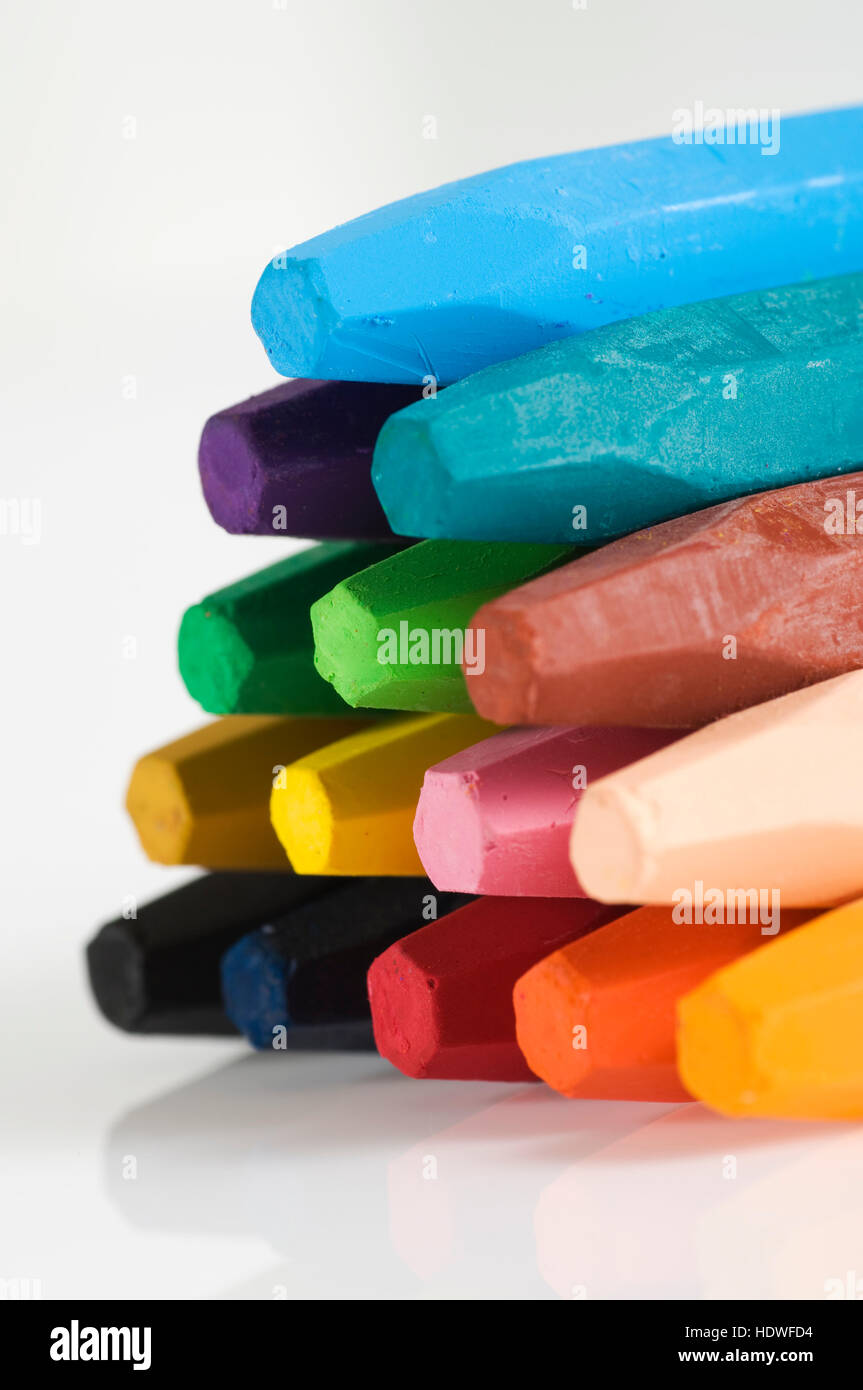 Group of crayons stacked on white background Stock Photo - Alamy