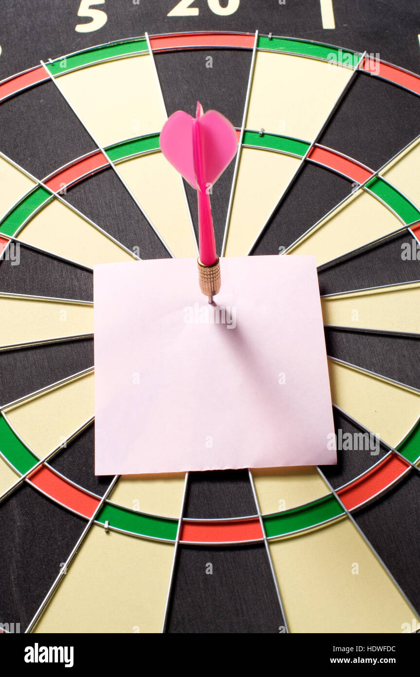Blank paper and dart board. You can put your writing here Stock Photo ...