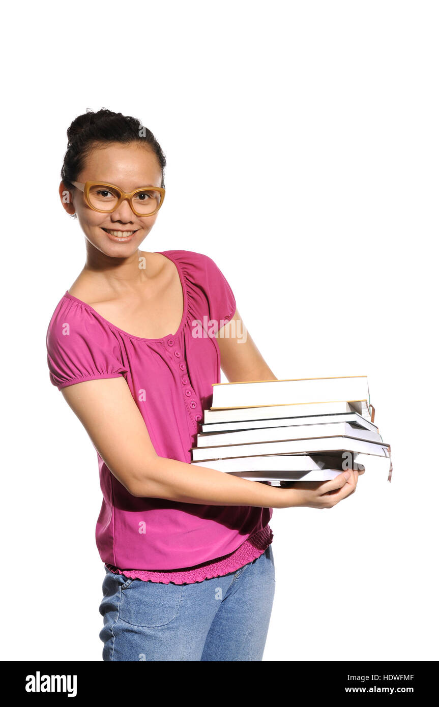 Asian college student carrying stack of books isolated over white ...
