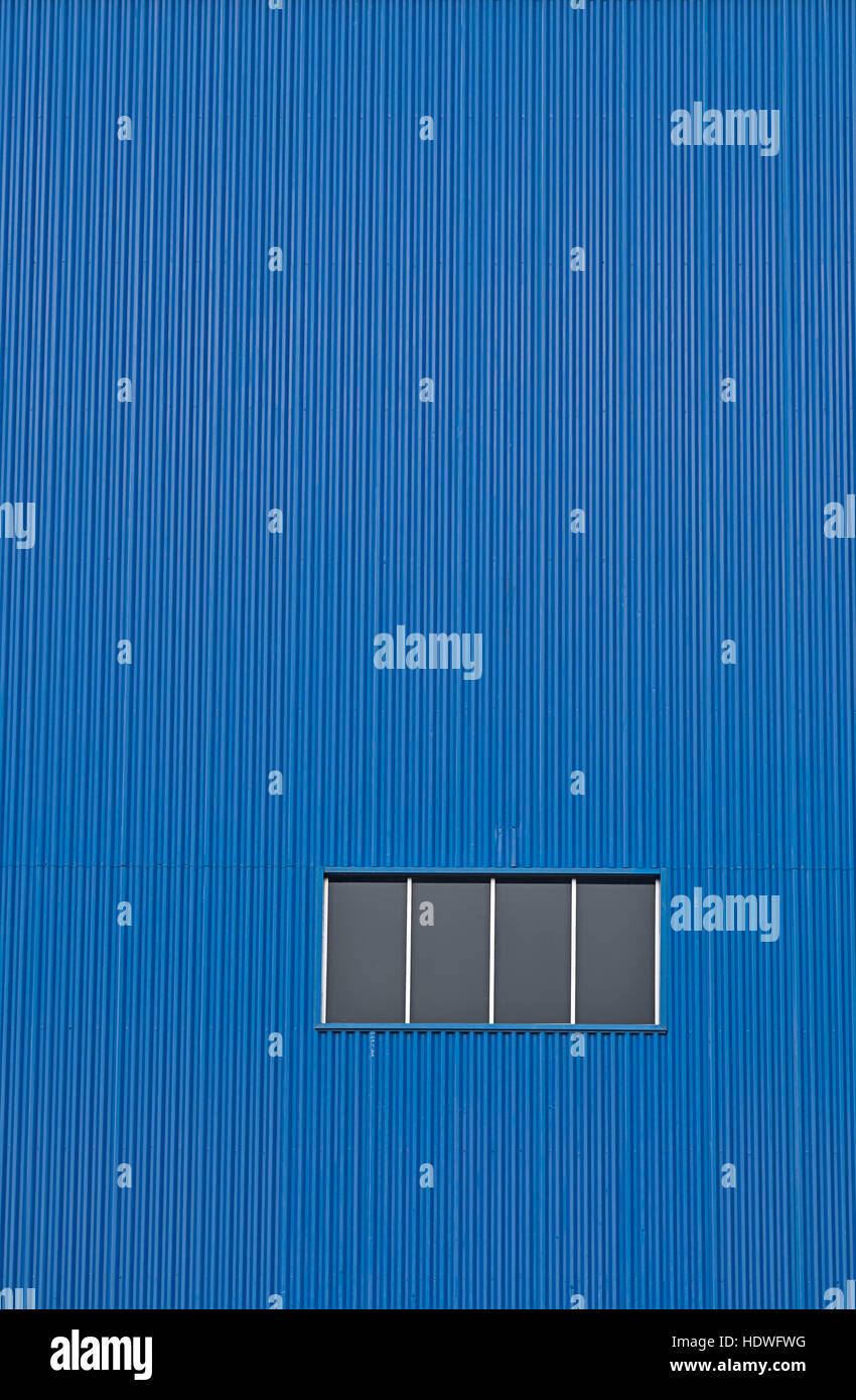 Factory window on blue wall. An industrial abstract Stock Photo - Alamy
