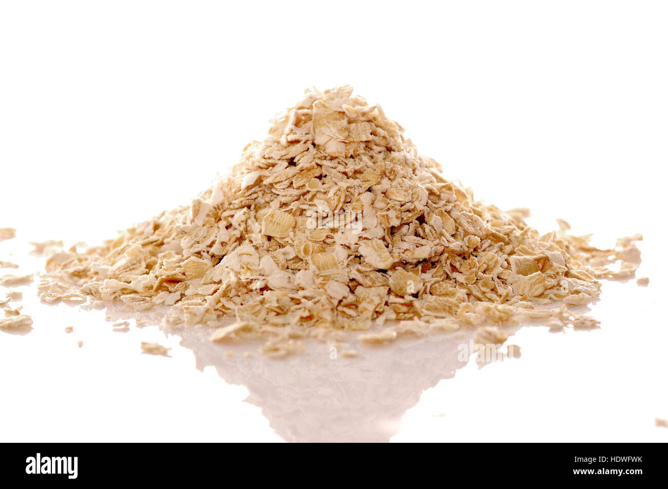 Pile of oatmeal isolated over white background Stock Photo - Alamy