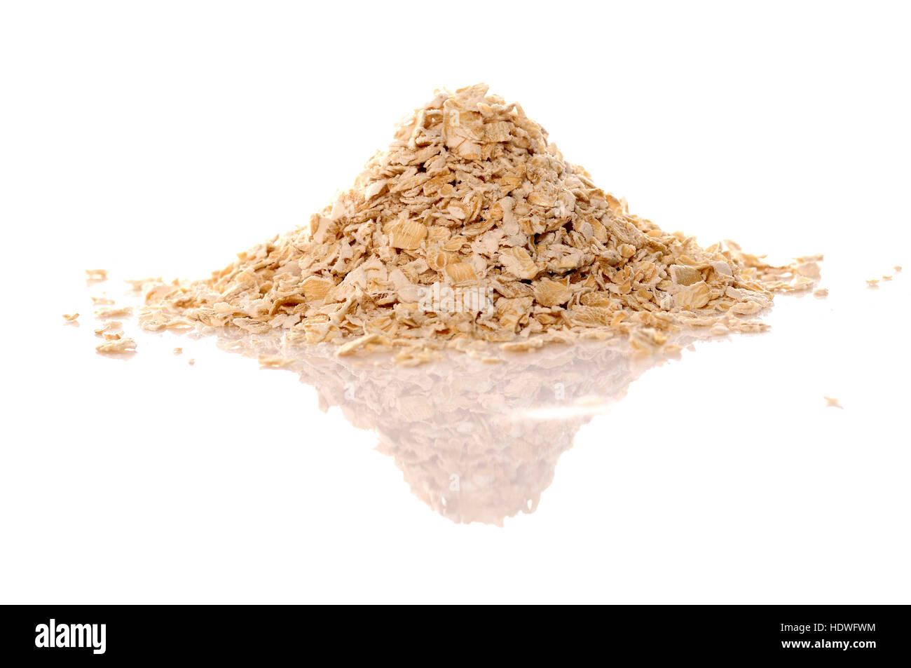 Pile of oatmeal isolated over white background Stock Photo - Alamy