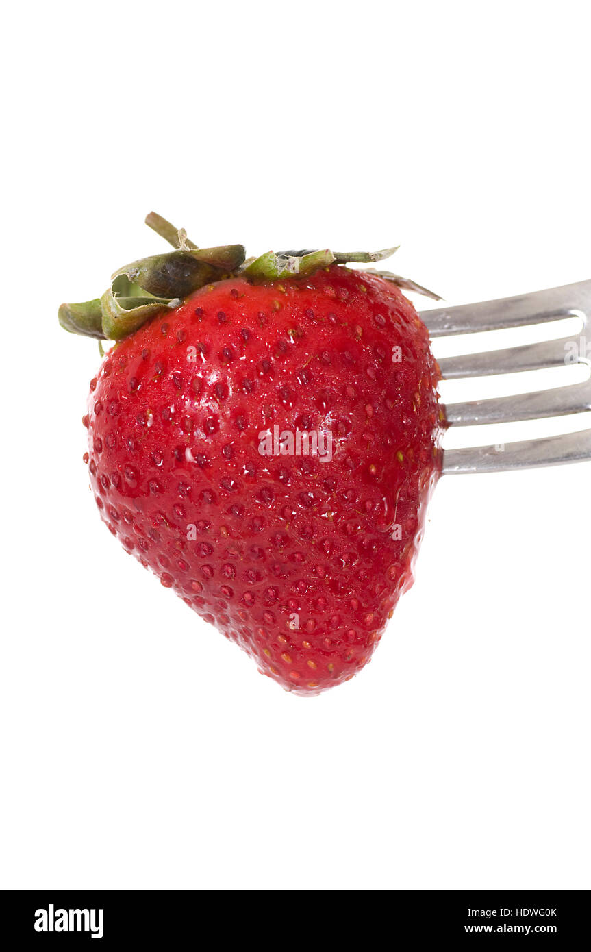 Strawberry on the fork isolated over white background Stock Photo - Alamy