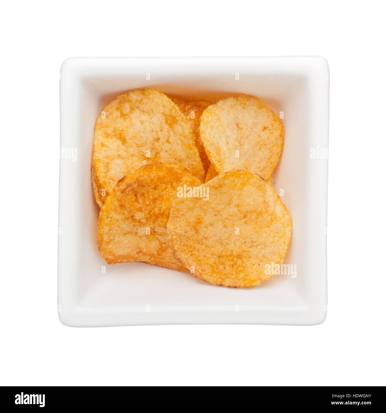 Pieces of potato chips in a square bowl isolated on white background ...