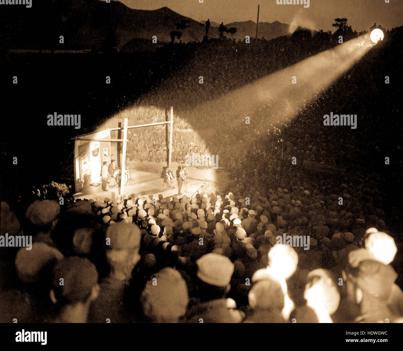 Men of 92nd Engineer Searchlight Company focus on Yodeler Elton Britt ...