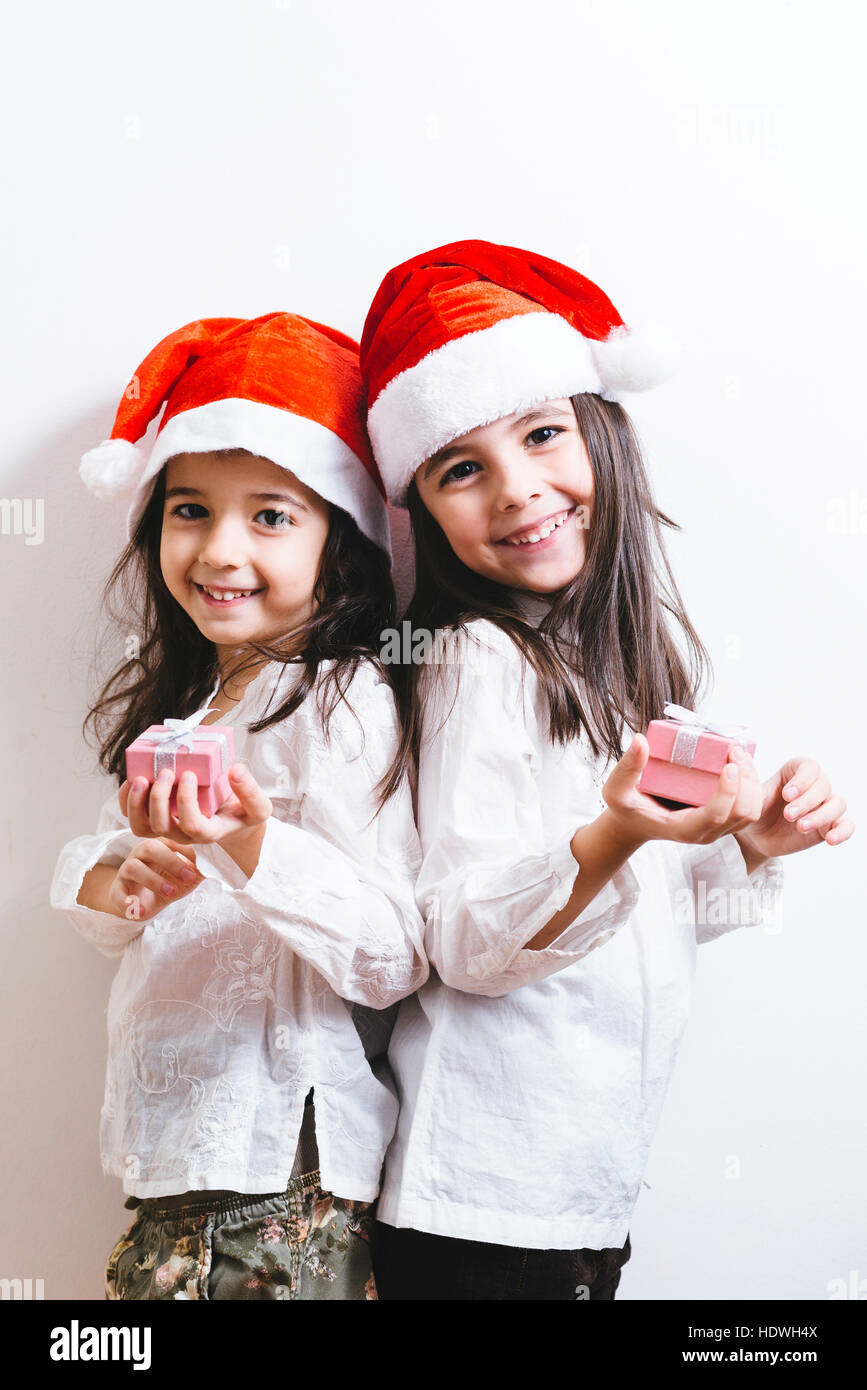 Two girls posing for Christmas and New Year holidays Stock Photo - Alamy