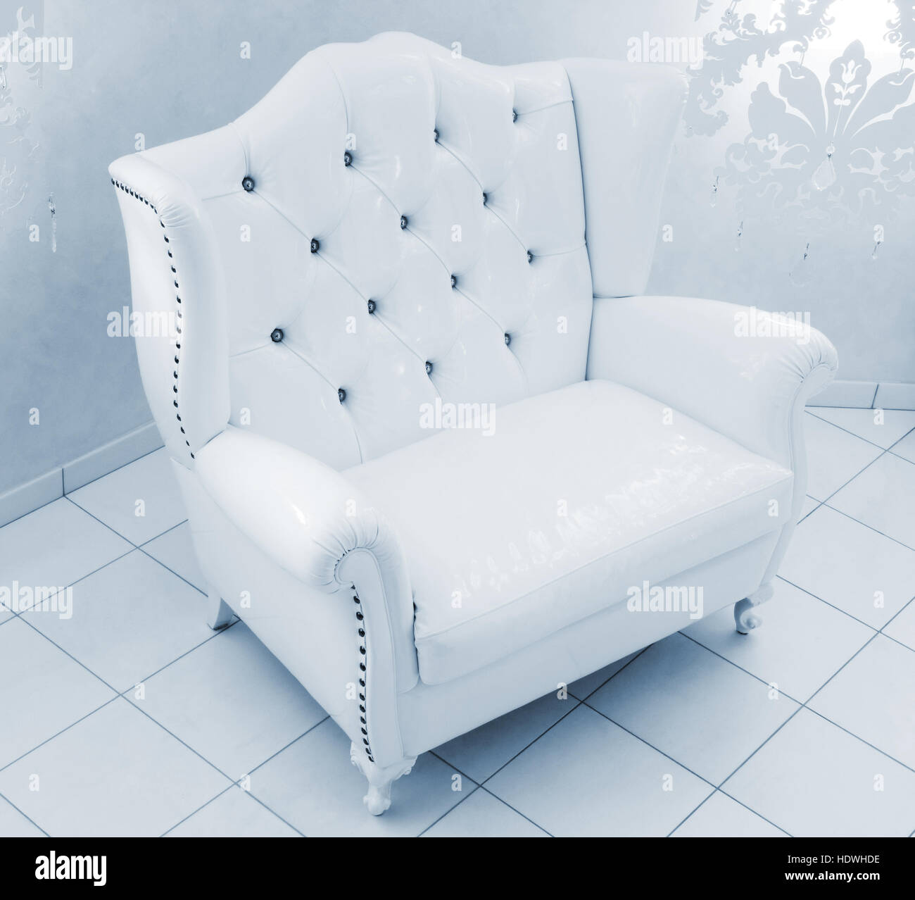 beautiful white armchair in a modern apartment Stock Photo - Alamy