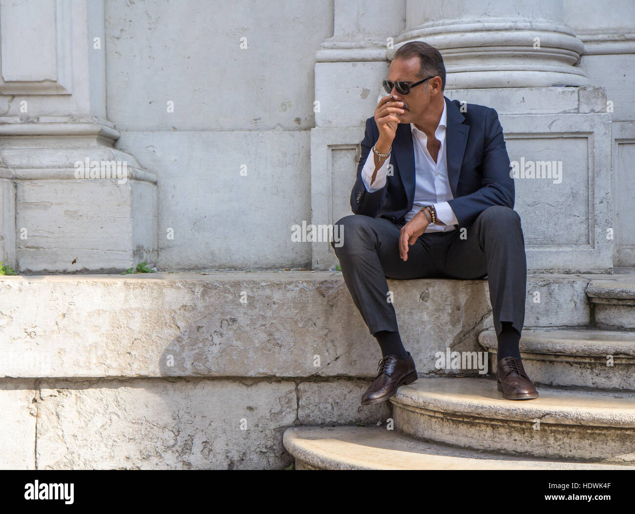 Man taking a smoking break Stock Photo - Alamy