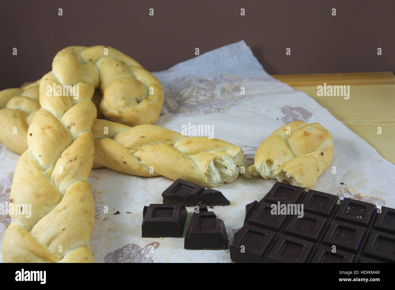 Two sweet bread sticks of Saint Blaise with a chocolate bar. This is a ...