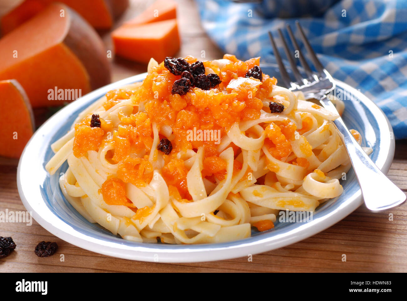 pasta with pumpkin and raisins - Italian recipe Stock Photo - Alamy