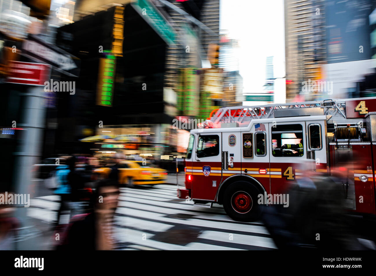 fire truck in an emergency situation trough the streets of Times Square ...