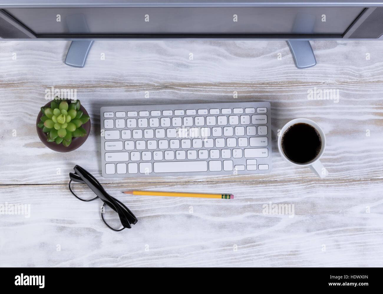 Overhead view of a working desktop consisting of computer keyboard ...