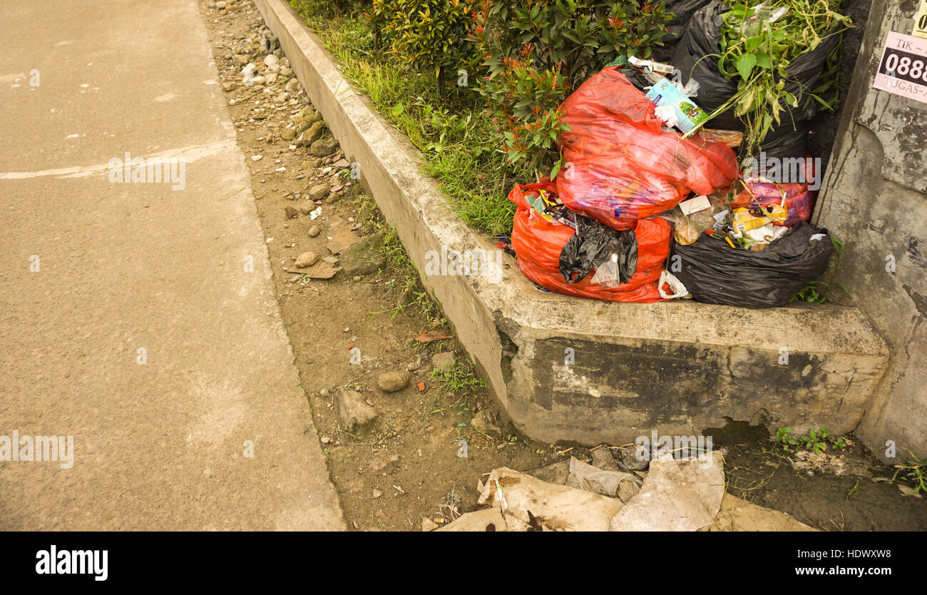 plastic trash bag in sidewalk using red bags photo taken in depok ...