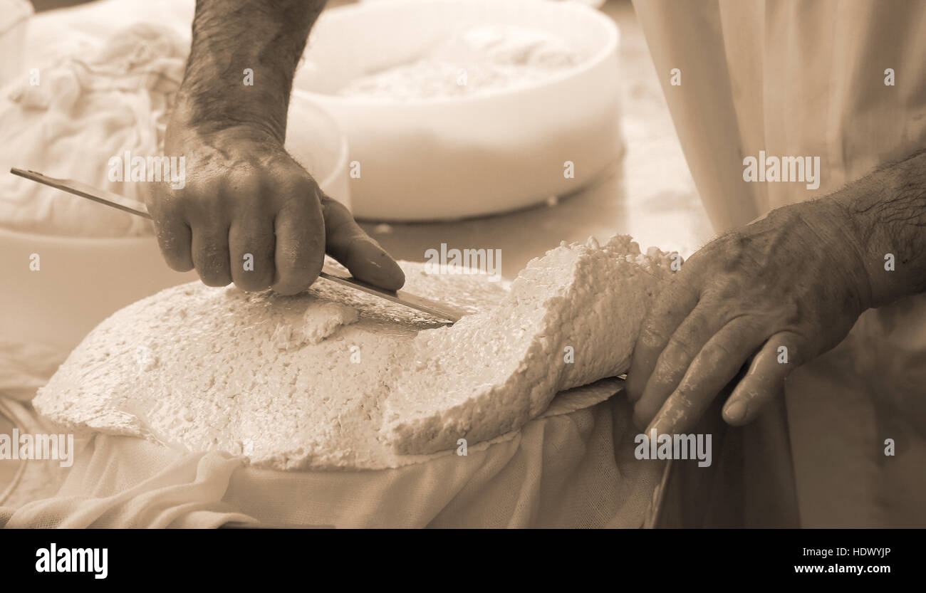 with a sharp knife a skilled man cuts the cheese Stock Photo - Alamy