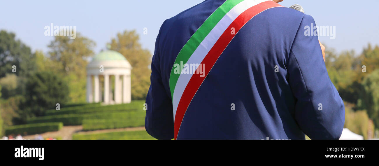 Italian mayor with the tricolor flag and the small temple in the ...