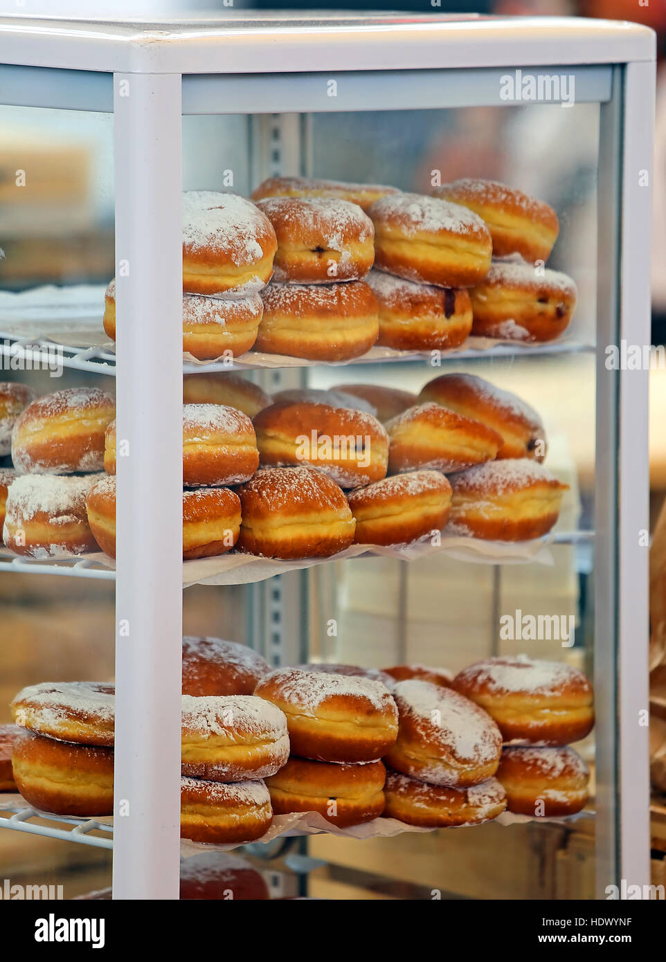 many Donuts for sale in bar very replenished Stock Photo - Alamy