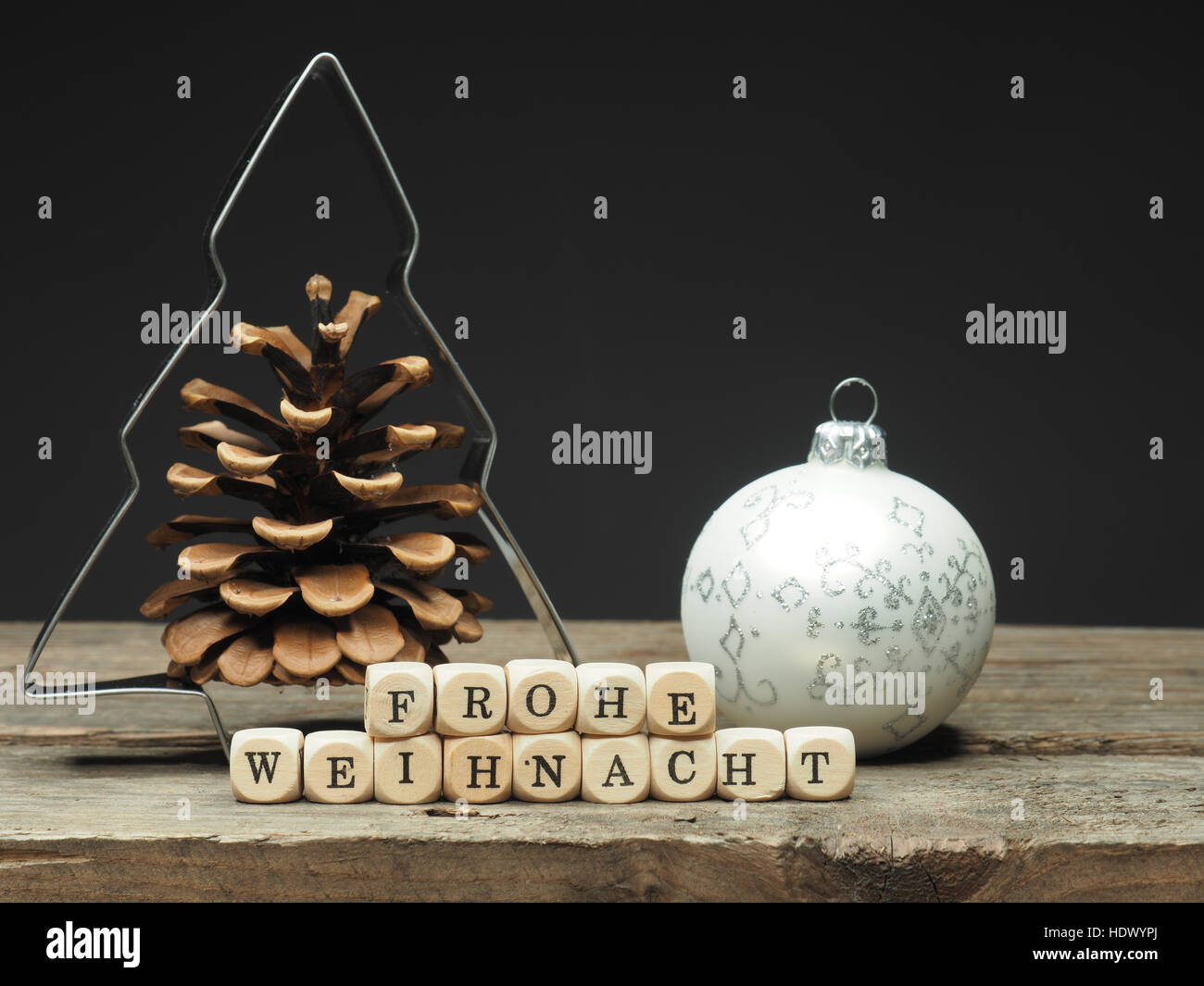 German Merry Christmas background with tree shape and small wooden ...