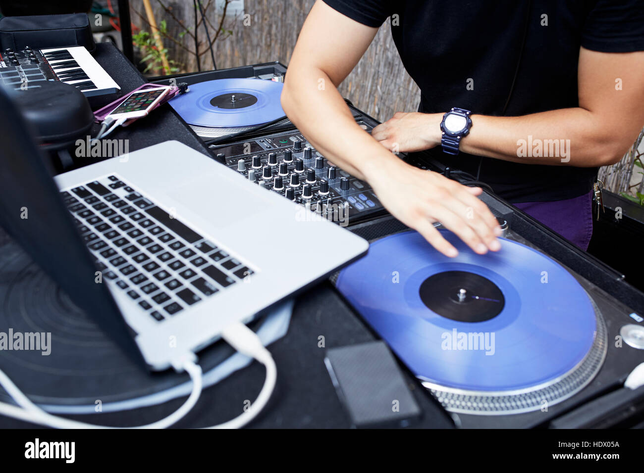 Hispanic dj playing music in backyard Stock Photo - Alamy