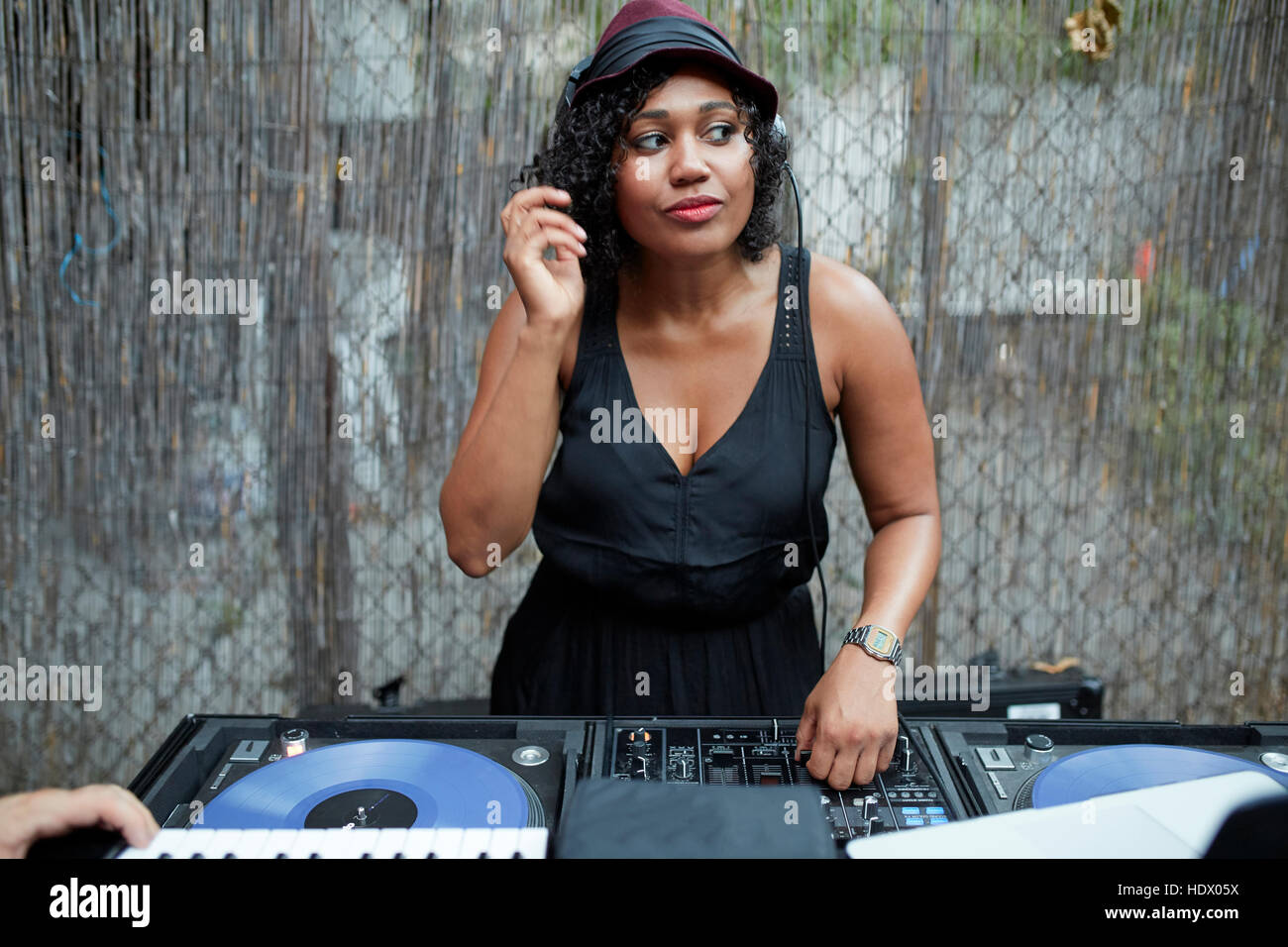 Mixed Race dj playing music in backyard Stock Photo - Alamy
