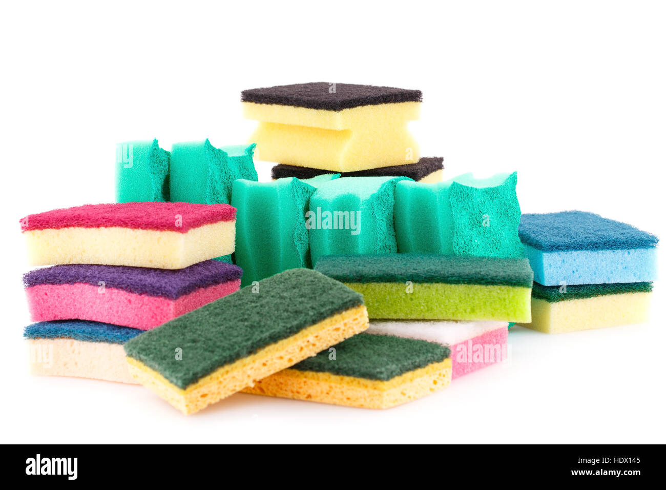 Pile of sponges isolated on white background Stock Photo - Alamy