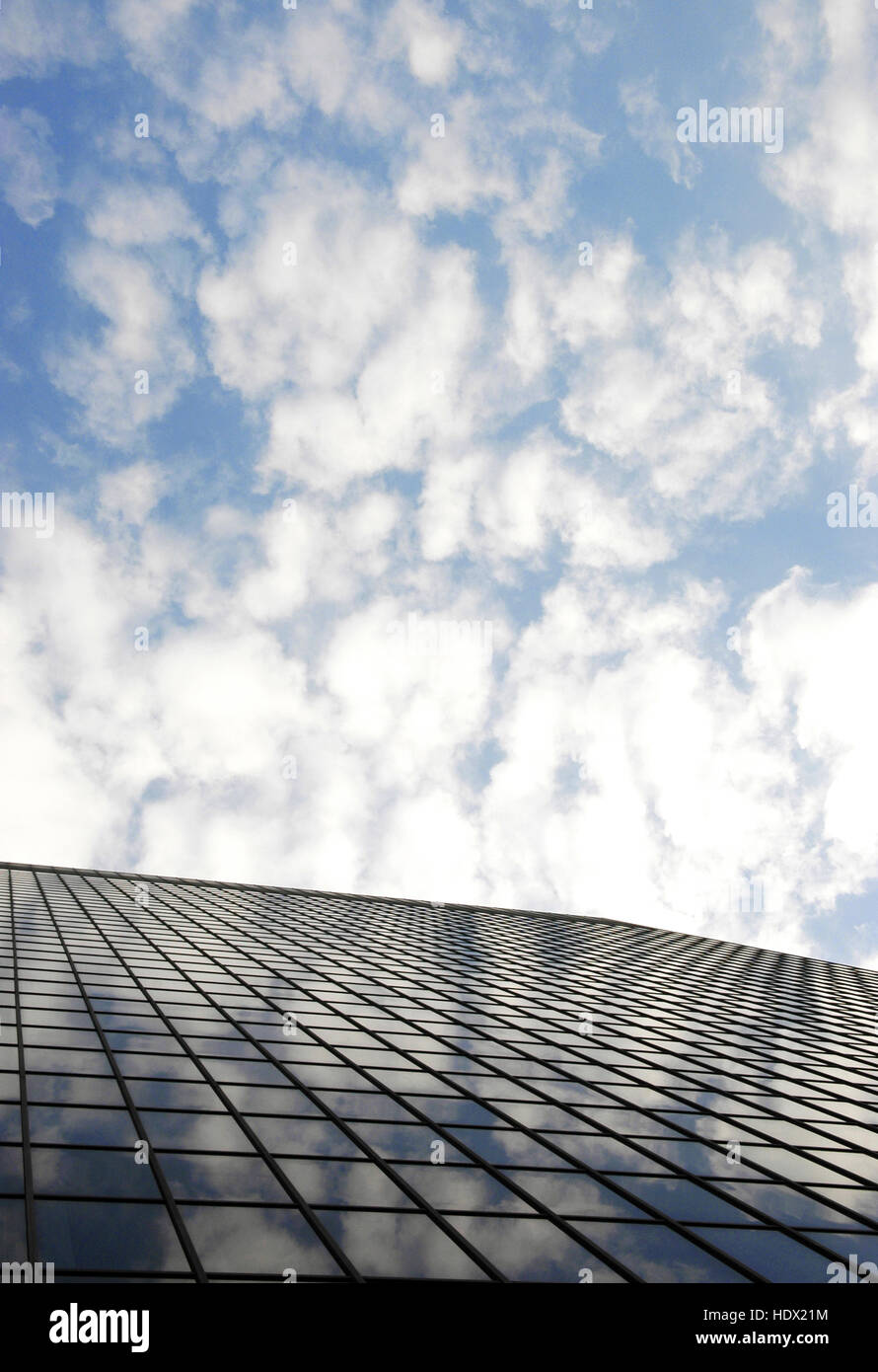 Reflection of clouds on highrise window Stock Photo - Alamy